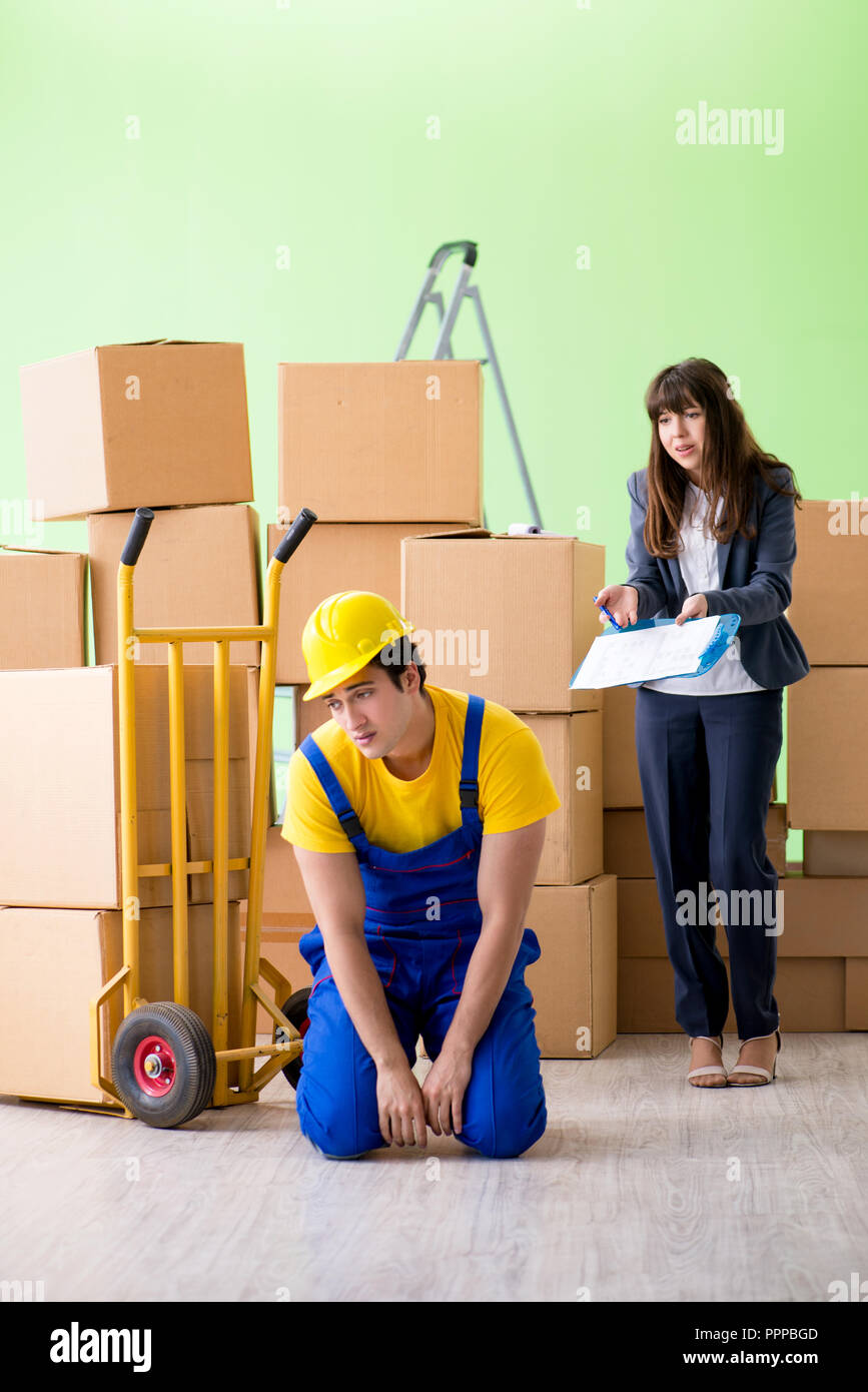 Woman boss and man contractor working with boxes delivery Stock Photo ...