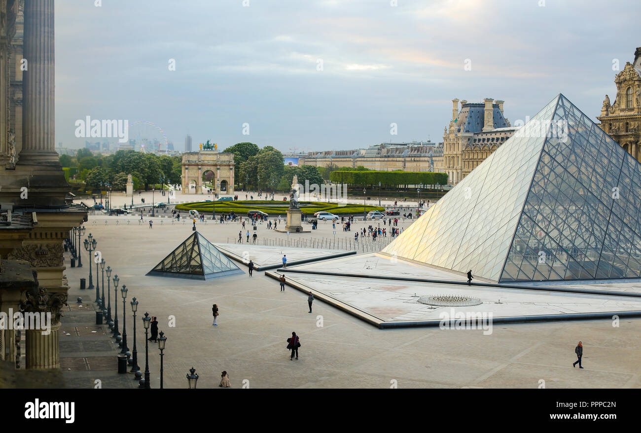Glass pyramid in Louvr, Paris, France. Concept of French landmarks and ...