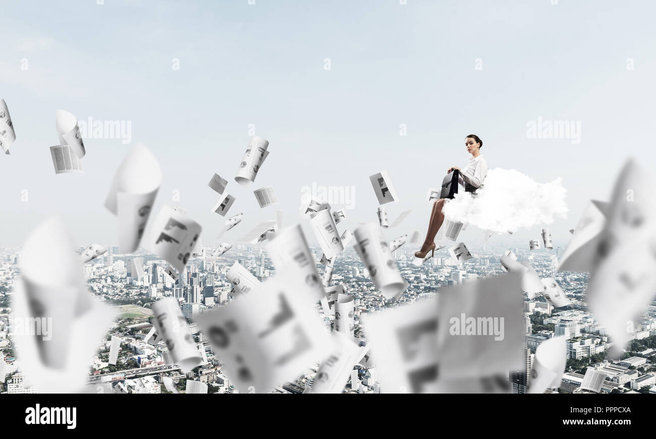 Woman float above city on cloud and papers flying around Stock Photo ...