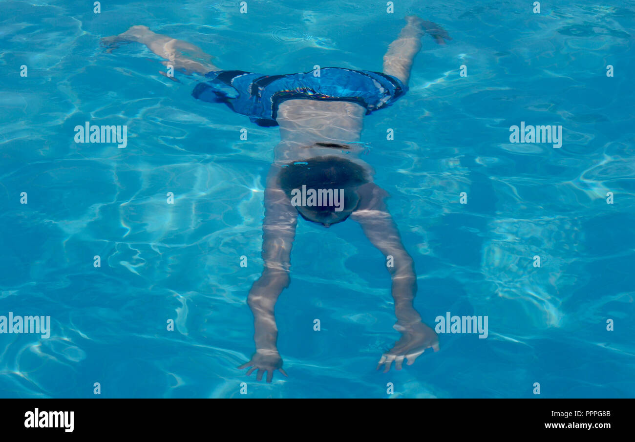 Ten year on boy swimming in the pool Stock Photo - Alamy