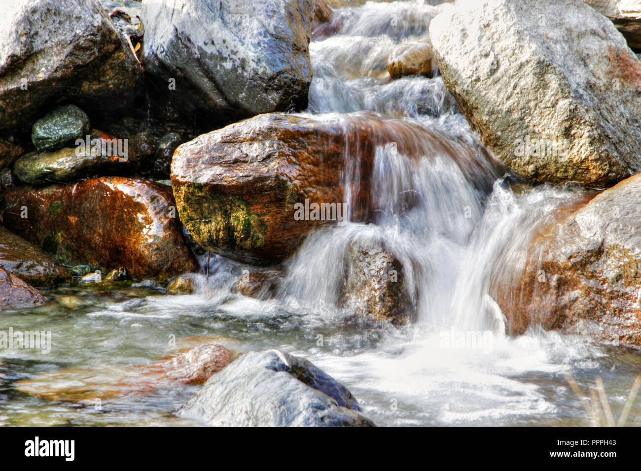Little falling water in the rock Stock Photo - Alamy