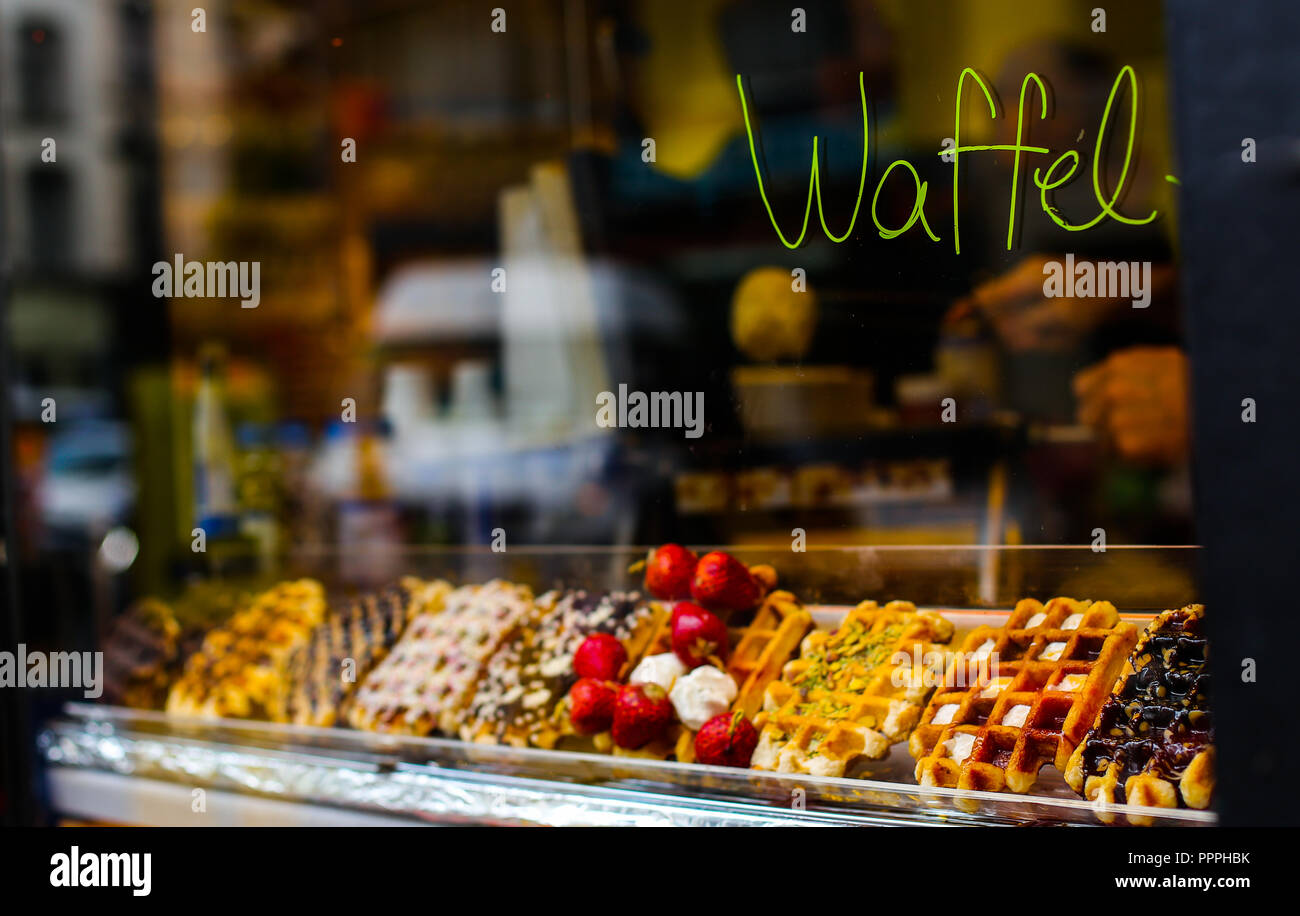 Showcase with sweet food and inscription waffels Stock Photo - Alamy