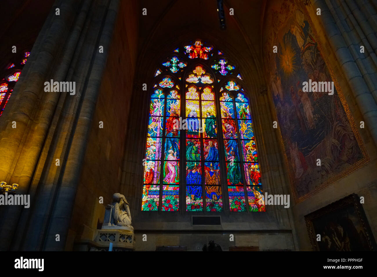 Inside st. Vitus. Cathedral and stained glass with Catholic icons Stock ...