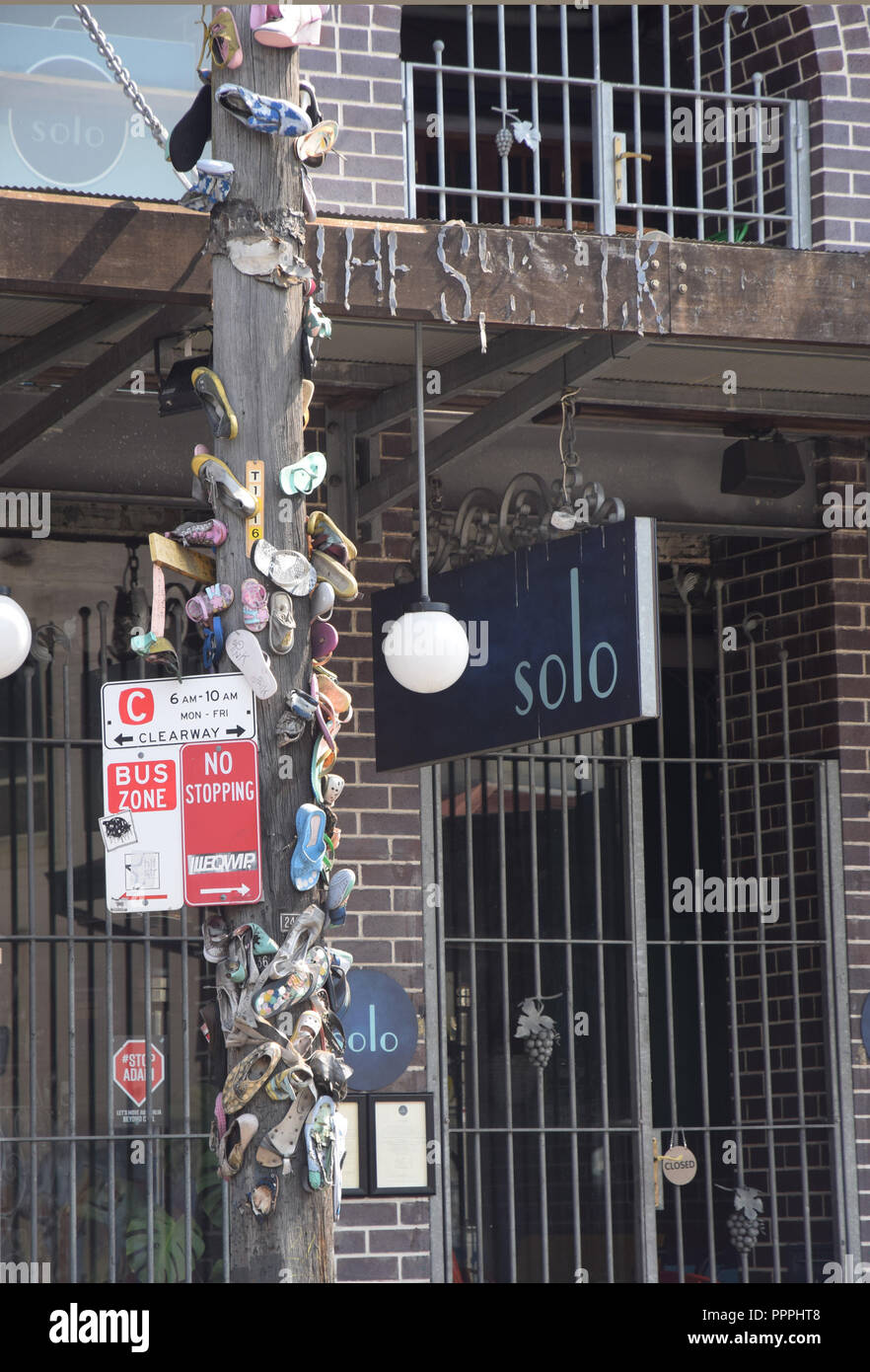 shoes attached to telephone pole, newtown, nsw ,sydney Stock Photo - Alamy