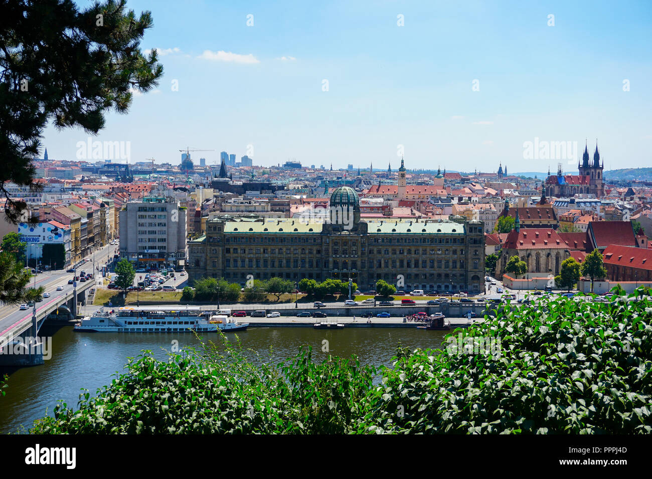 View of Prague with river Vltava and amazing buildings with red roofs ...