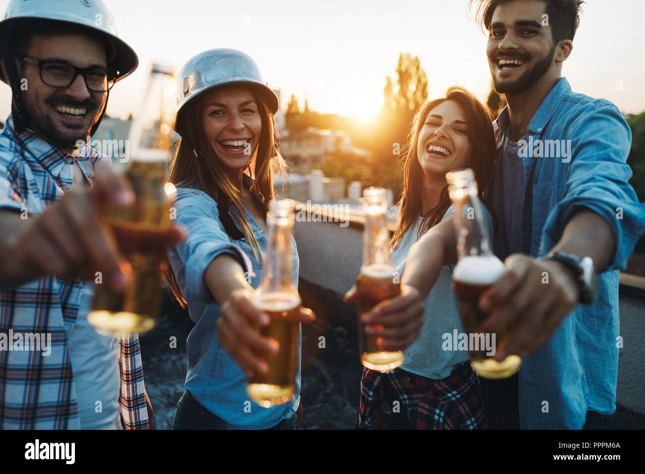 Happy friends laughing and smiling outdoors Stock Photo - Alamy