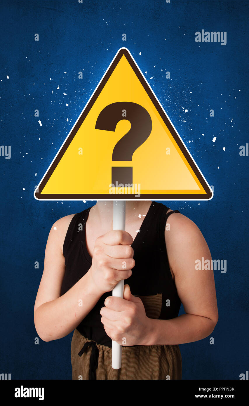 Casual young woman holding yellow sign with question mark Stock Photo ...