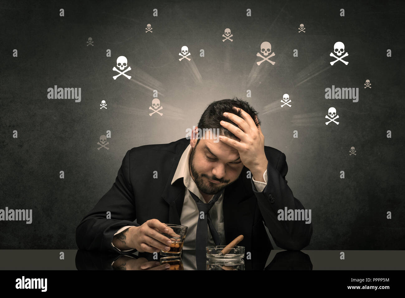 Loser drunk man sitting at table with skulls concept around Stock Photo ...