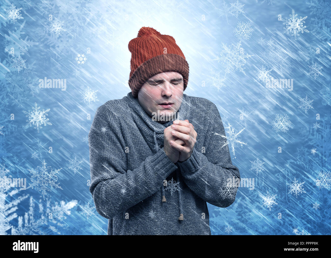 Gorgeous boy wearing warm clothing and freezing in cool snowy concept ...