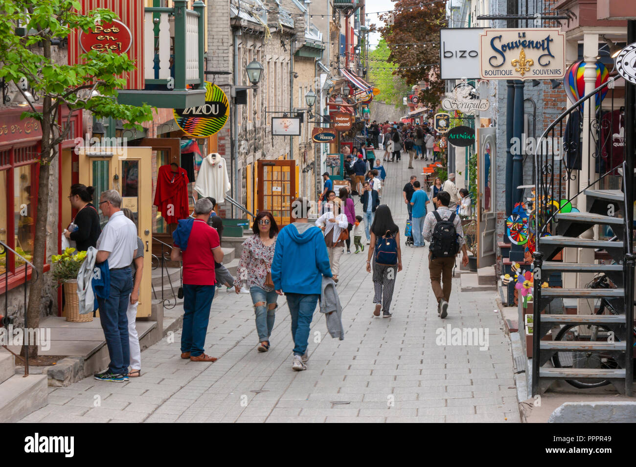 Crowd of tourists strolling on Rue du Petit Champlain – a famous ...
