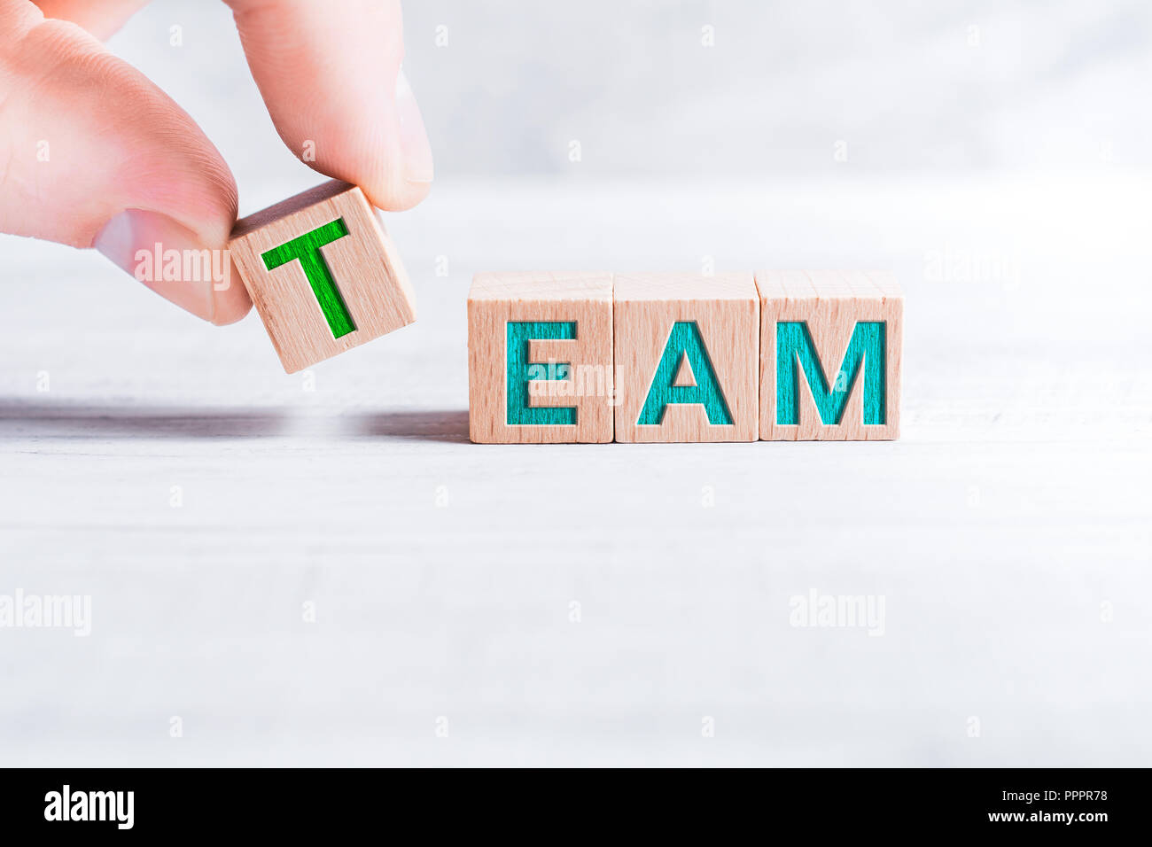 The Word Team Formed By Wooden Blocks And Arranged By Male Fingers On A ...