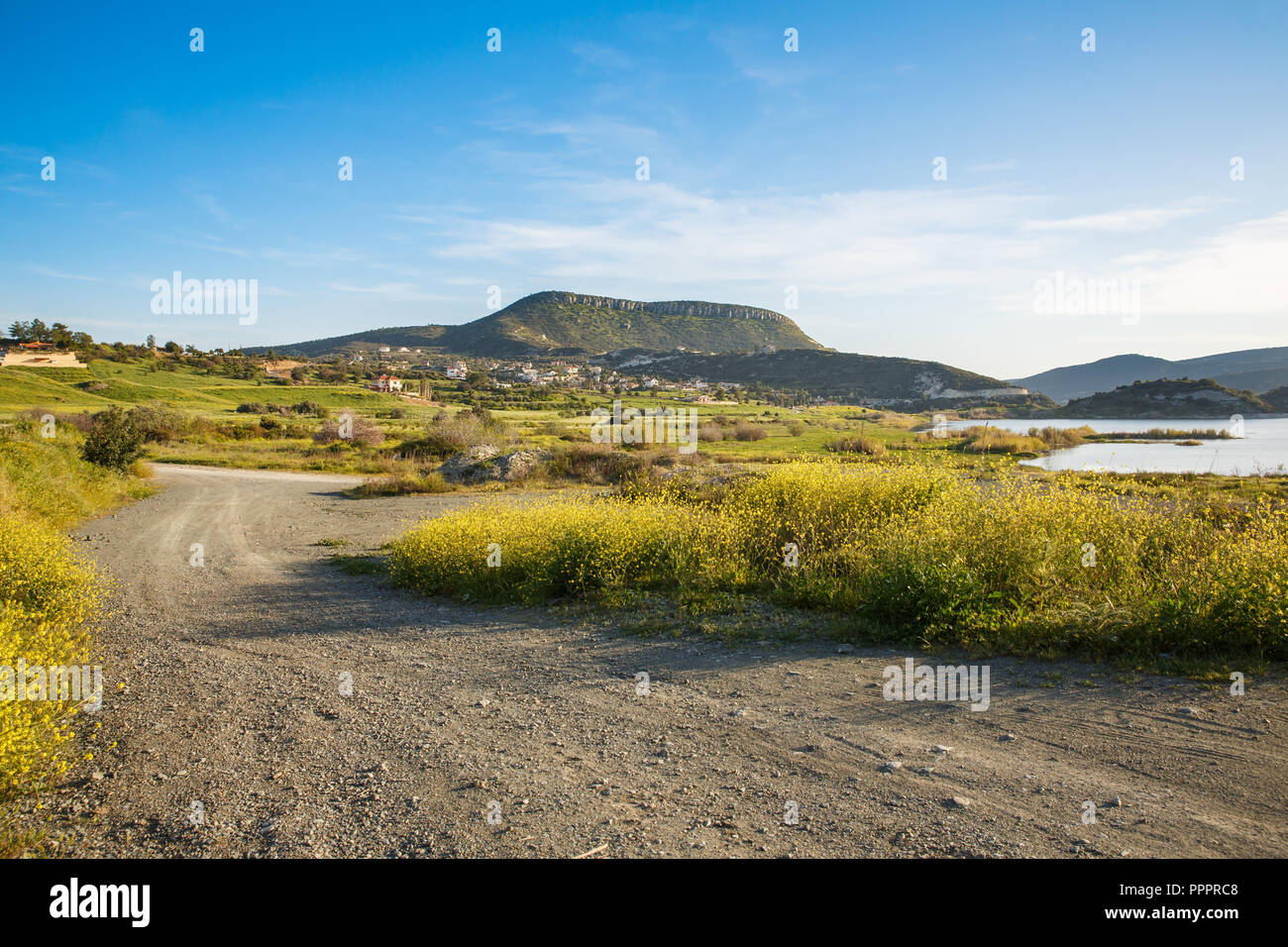 Cyprus landscape with mountains, lake and village Stock Photo - Alamy