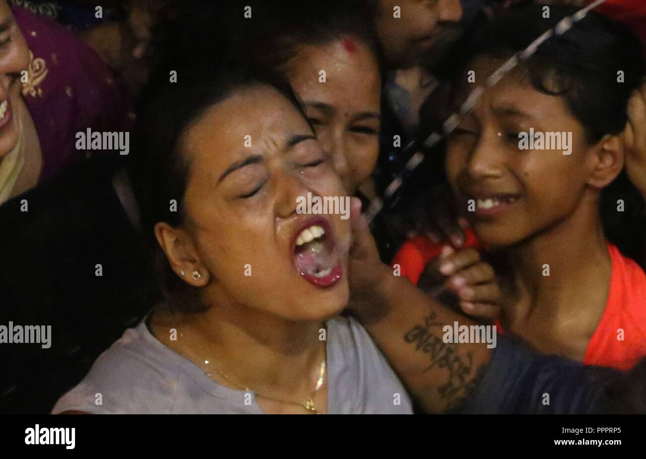 Kathmandu, Nepal. 26th Sep, 2018. A Nepalese woman drinks homemade ...