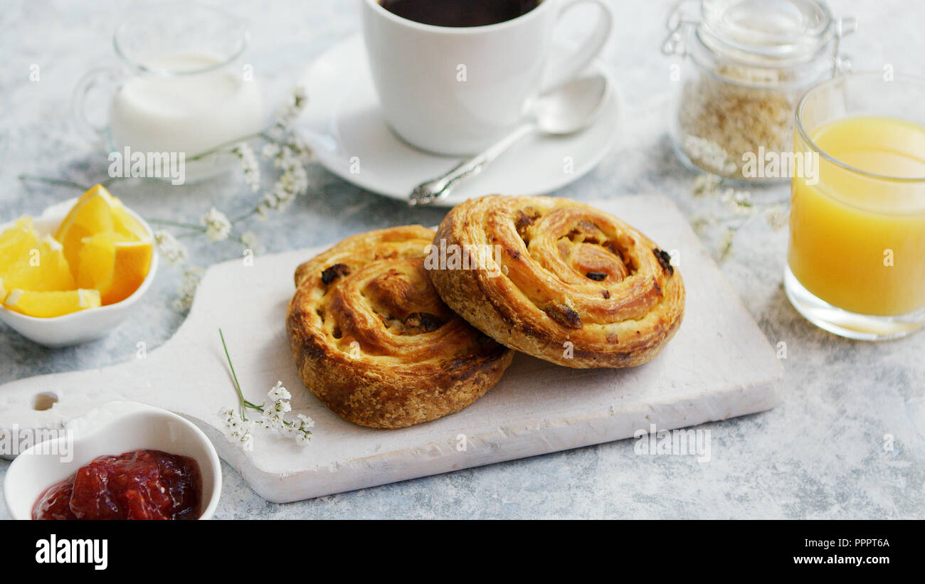 Sweet buns on board for breakfast Stock Photo - Alamy