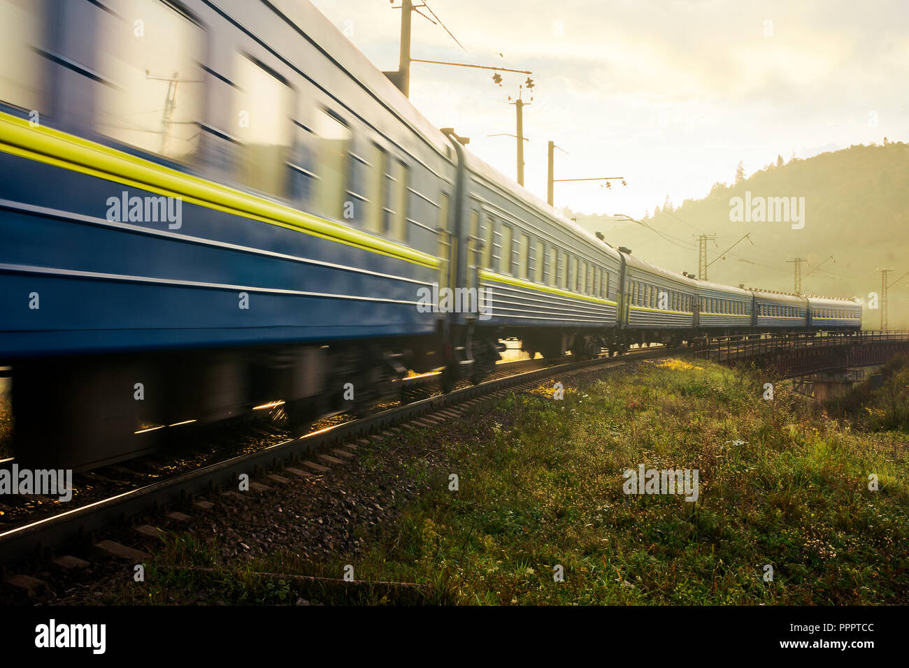 fast moving train through viaduct in mountains. old fashioned ...