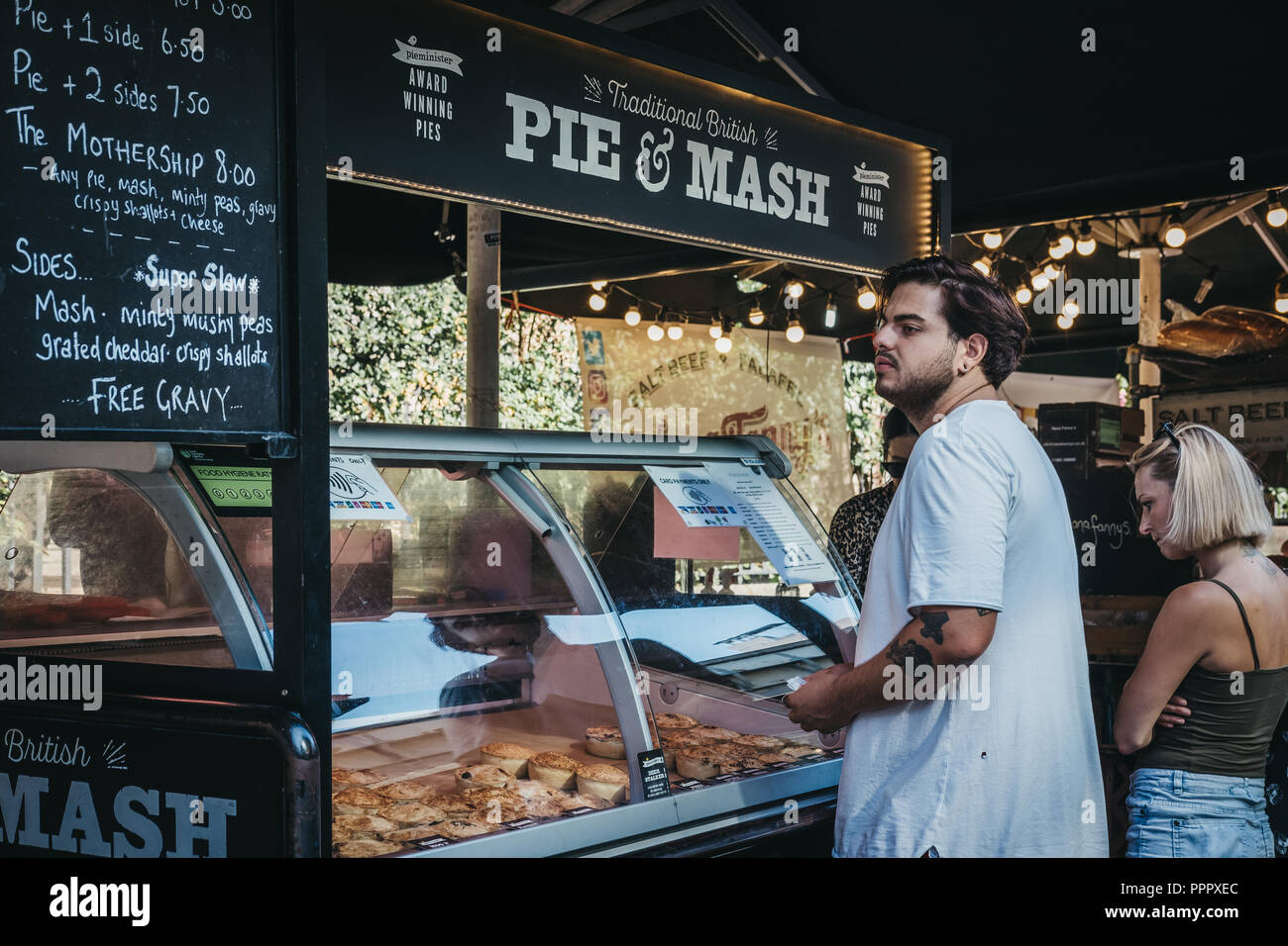 London, UK - September 17, 2018: Man buying fresh pies from Pieminster ...