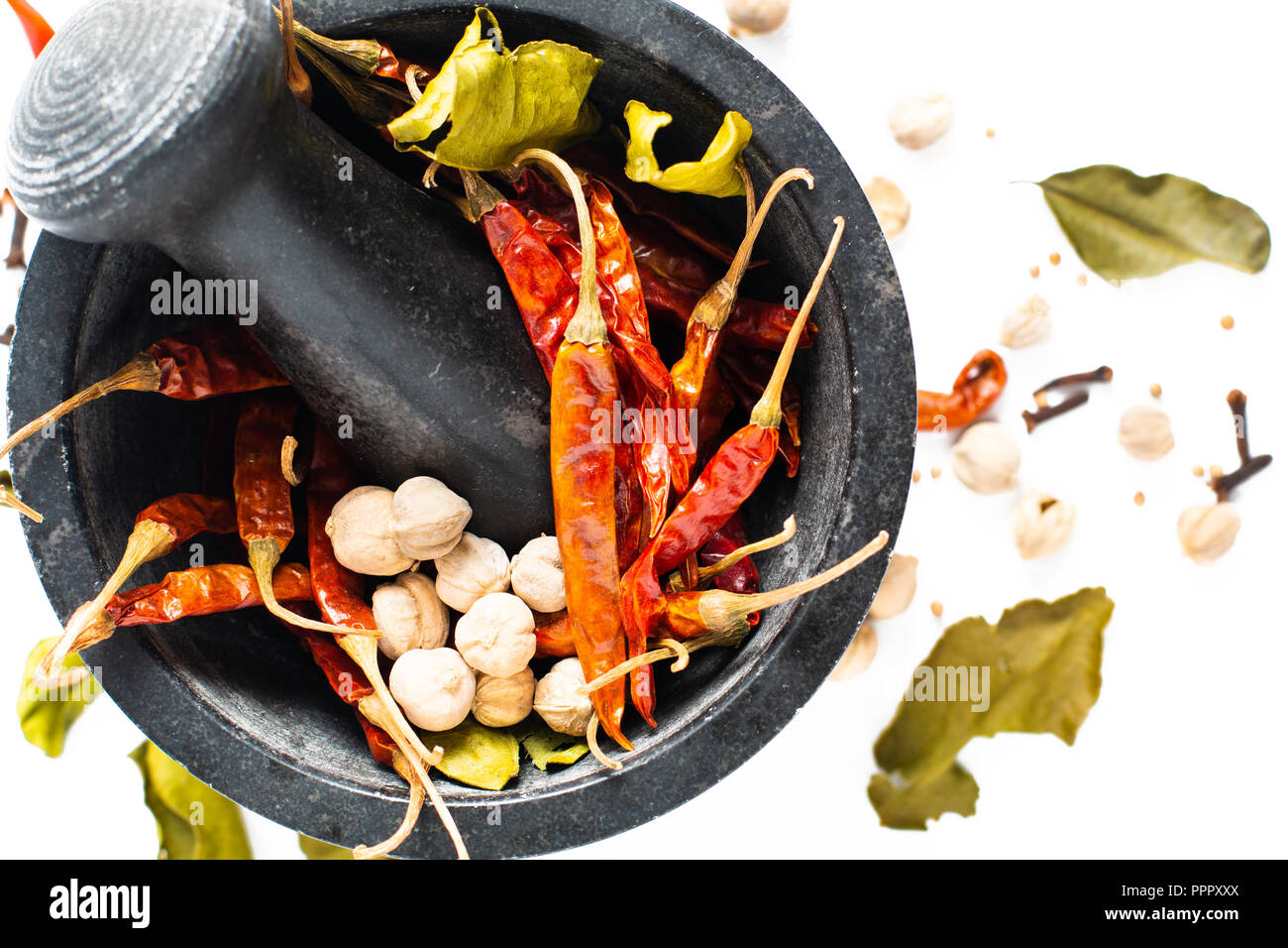 Food concept Exotic Thai dried spices chilies in mortar, Kaffir lime ...