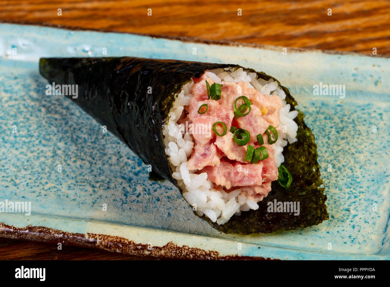 Japanese handroll temaki with fish and rice Stock Photo - Alamy