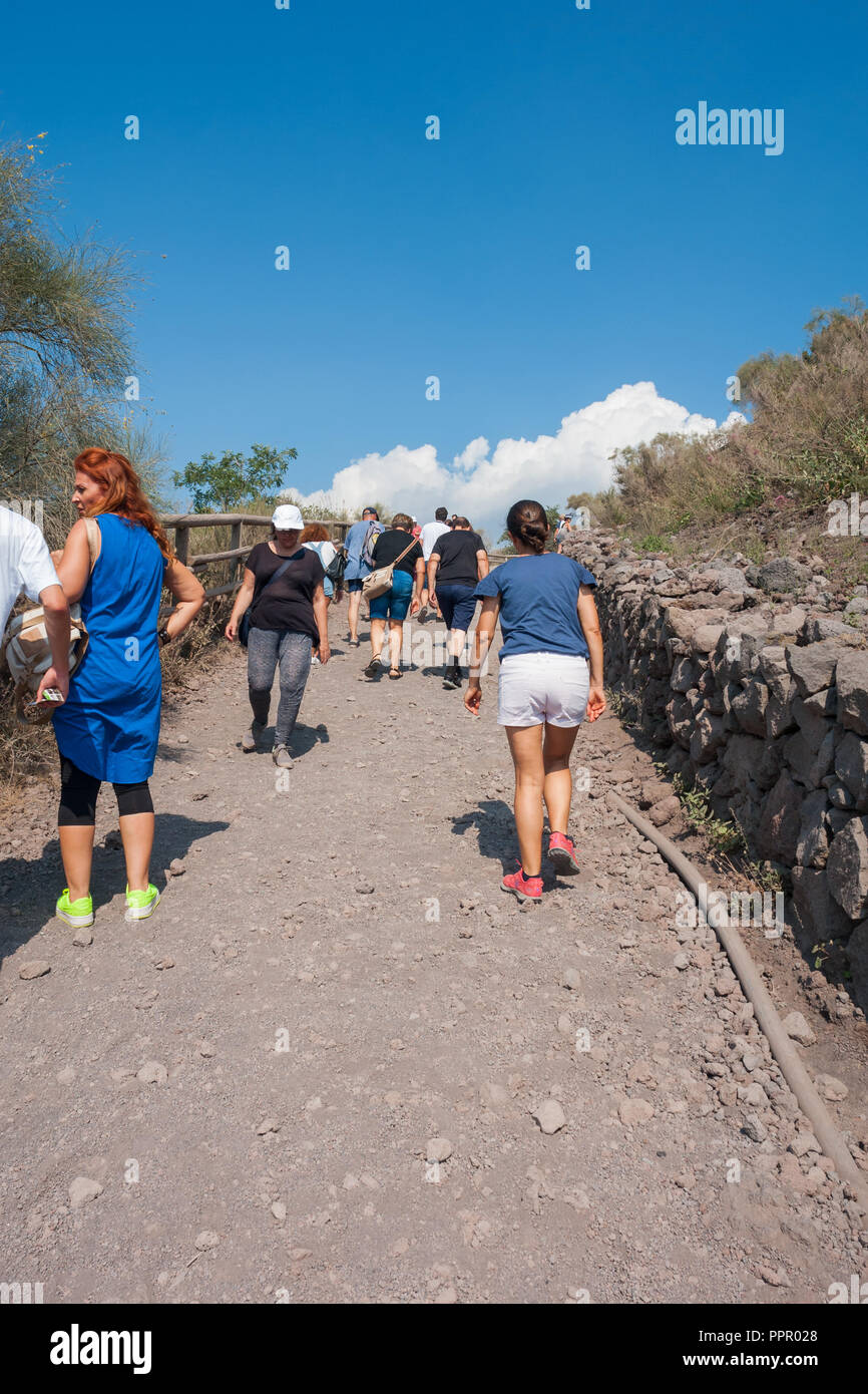 MOUNT VESUVIUS, ITALY - AUGUST 1, 2018: Tourists walk around the crater ...