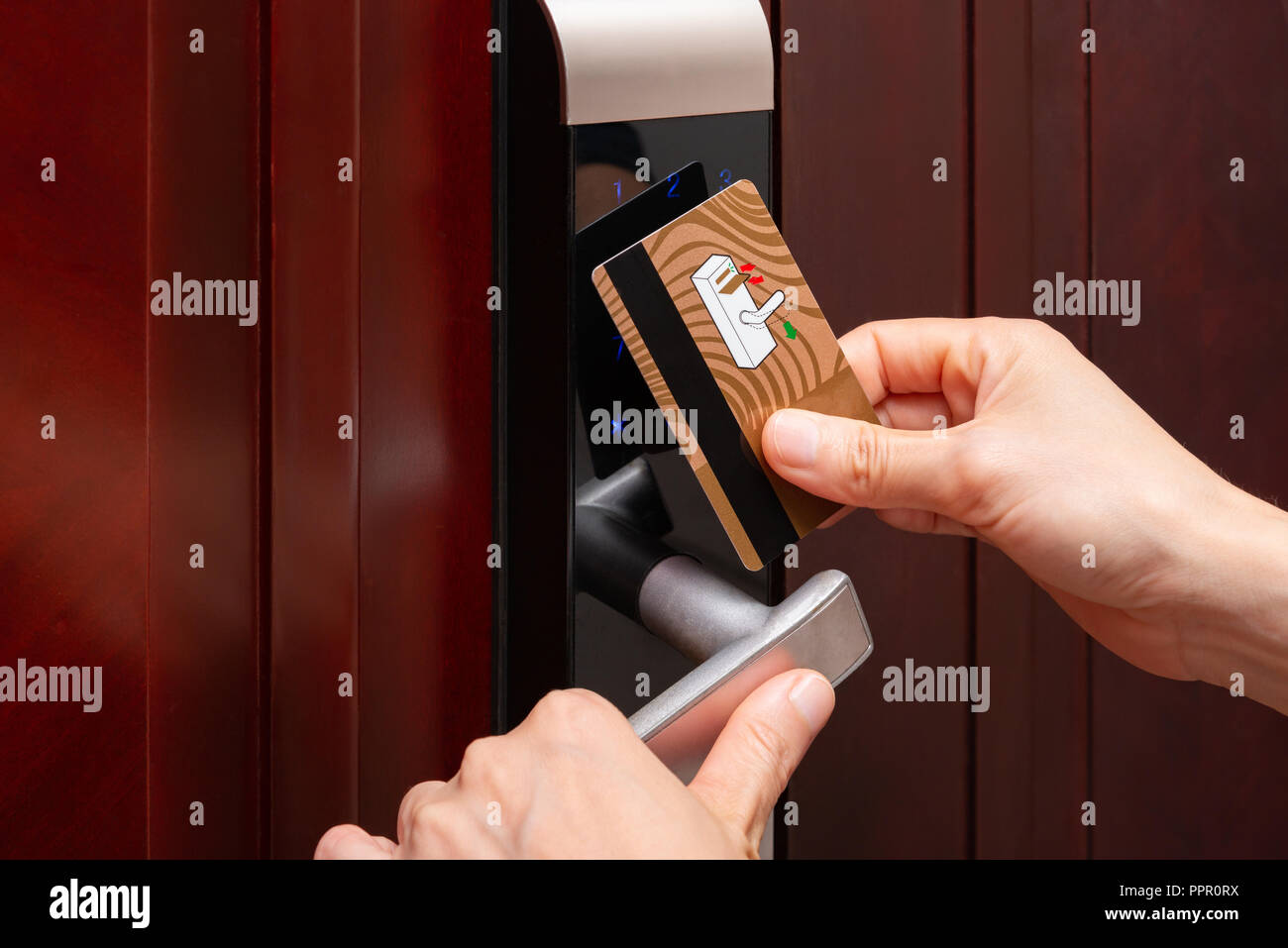 lady opening an electronic door lock by a security card Stock Photo - Alamy