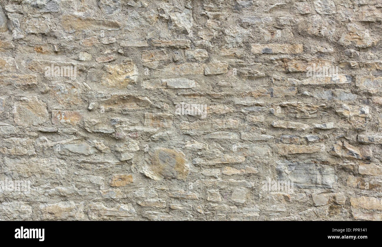 Medieval wall built of ancient stone Stock Photo - Alamy
