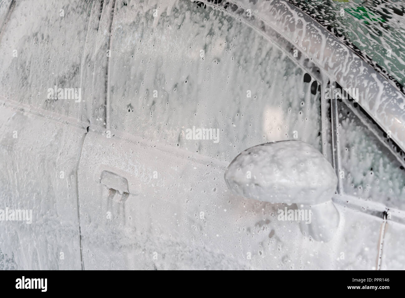 washing a car with soapy liquid Stock Photo - Alamy