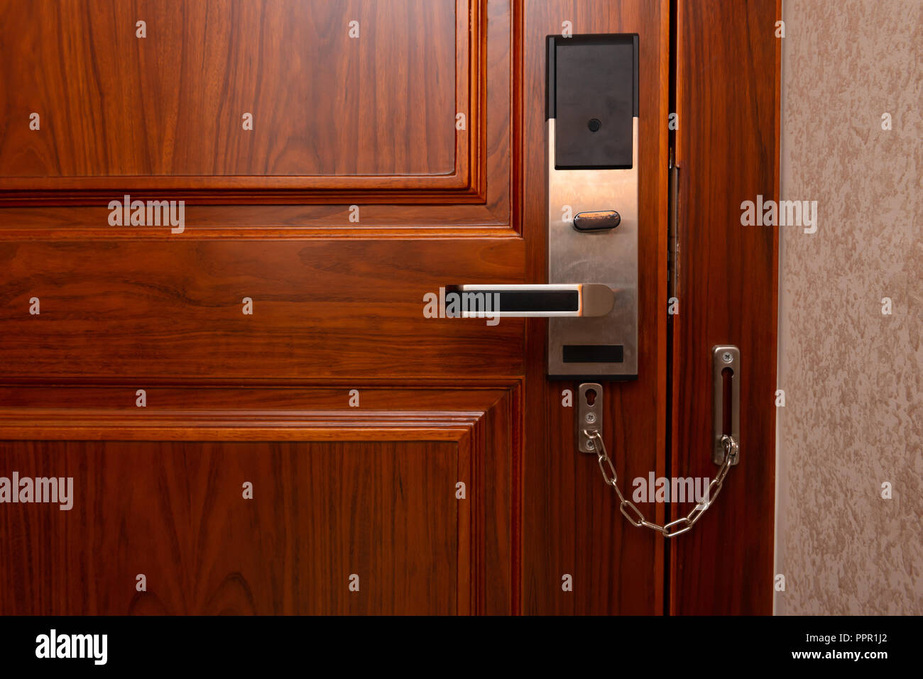 electric door locked with stainless steel safety latch Stock Photo - Alamy