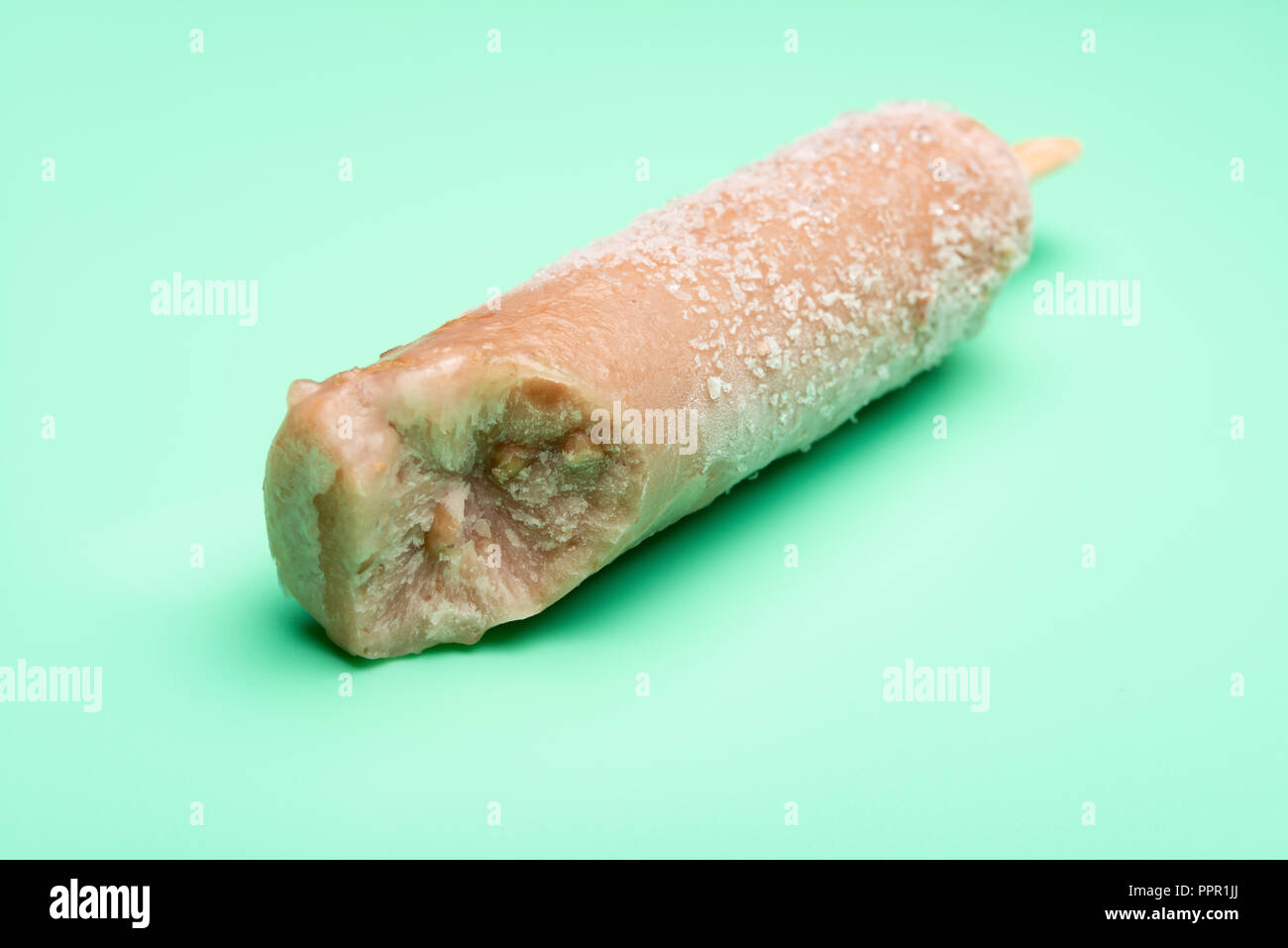 green bean popsicle on a light green background with a bite Stock Photo ...