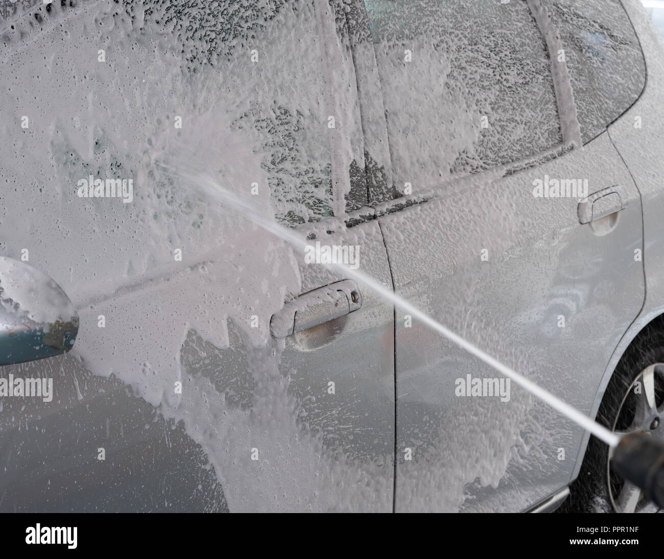 washing a car with soapy liquid Stock Photo - Alamy