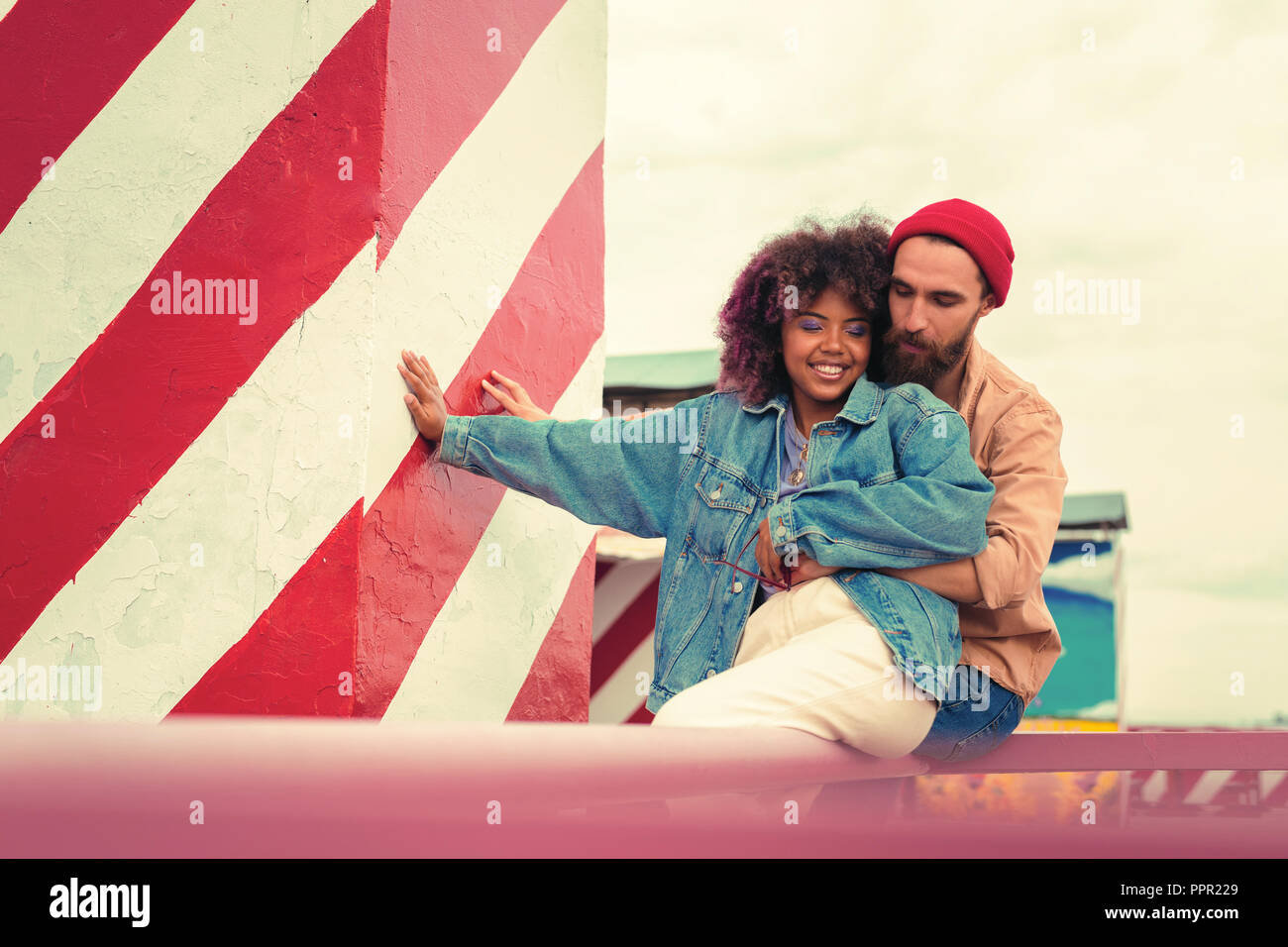 Peaceful couple sitting with their eyes closed and hugging Stock Photo ...