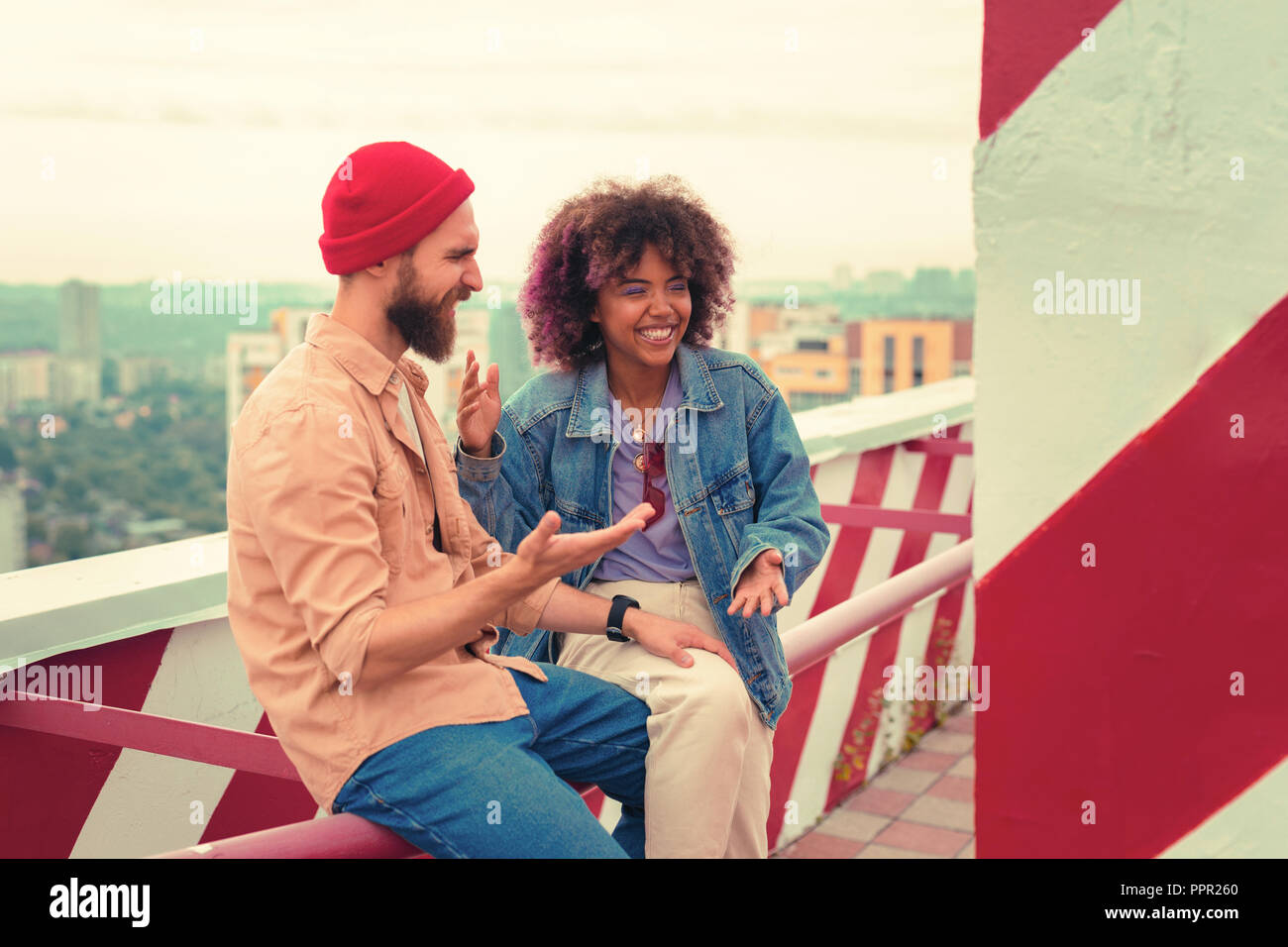 Two people using gestures and laughing at the funny joke Stock Photo ...