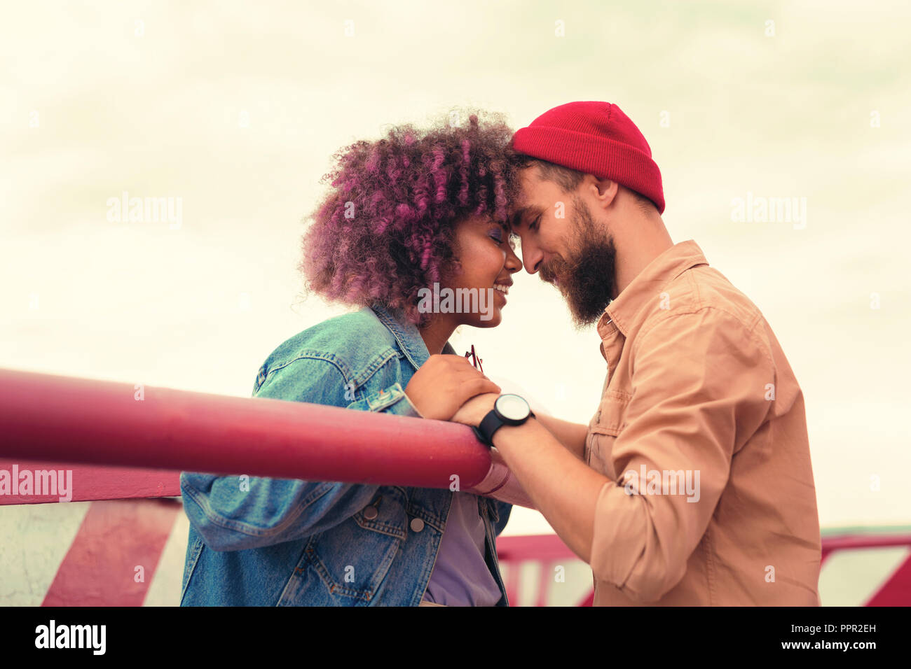 Adorable couple smiling and touching their foreheads Stock Photo - Alamy
