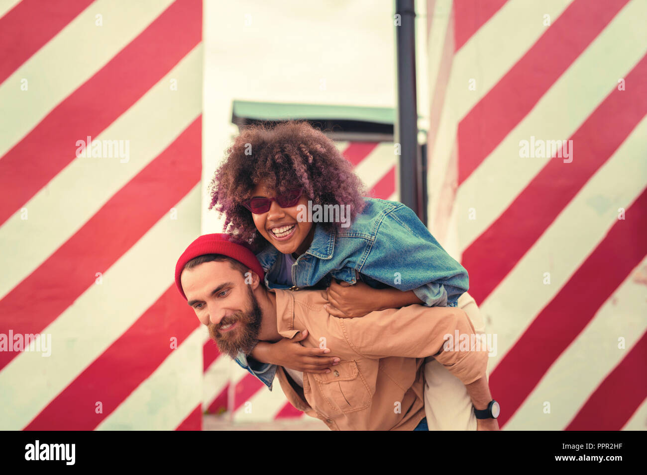 Adorable young couple having fun together and laughing Stock Photo - Alamy