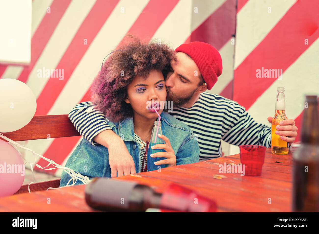 Man kissing woman on check hi-res stock photography and images - Alamy