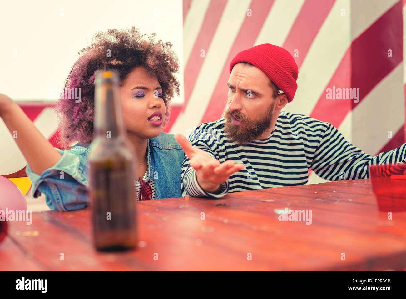 Two people having emotional talk while feeling sleepy after party Stock ...