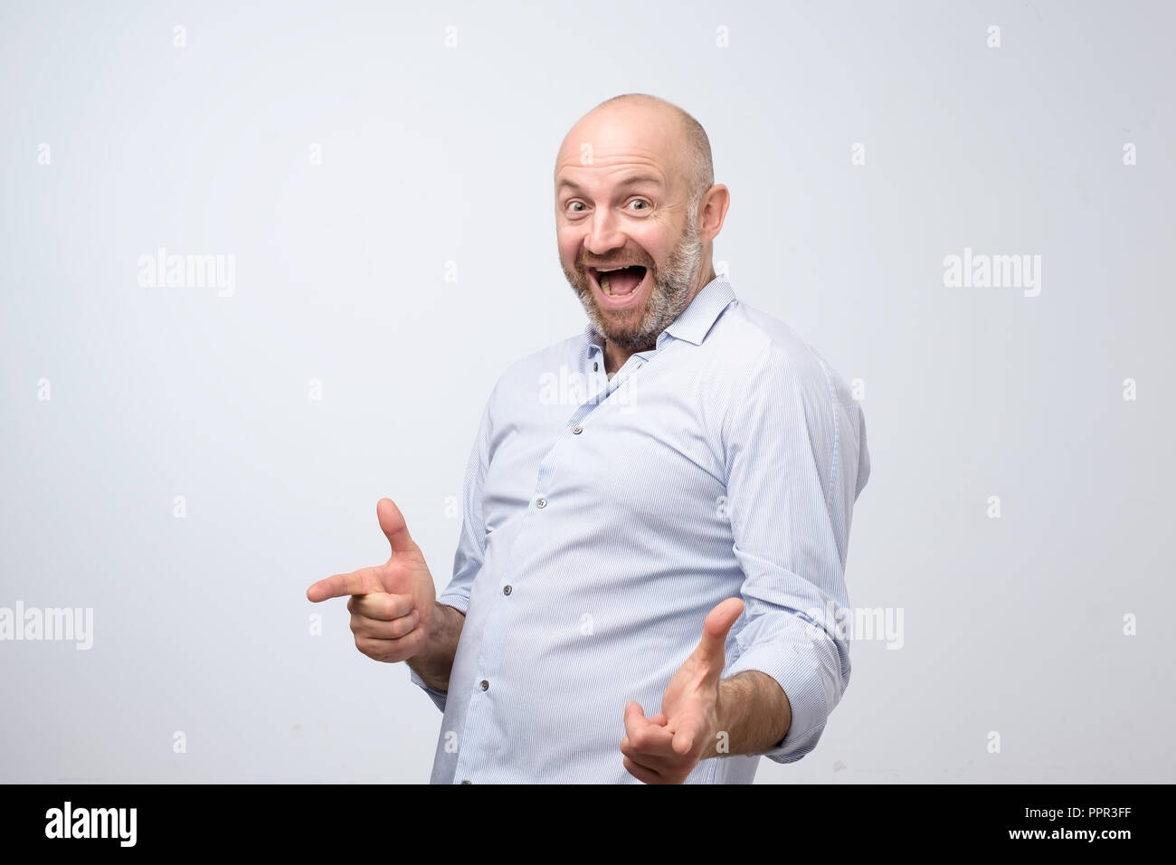 Delighted handsome guy posing hi-res stock photography and images - Alamy