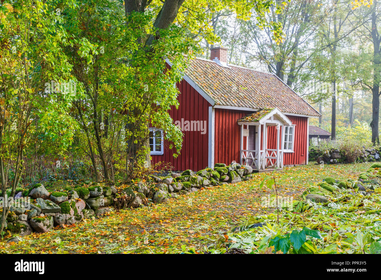 Old wooden cottage by a path in the countryside Stock Photo - Alamy