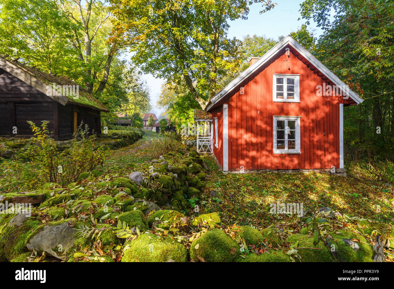 Idyllic red house in an old village Stock Photo - Alamy