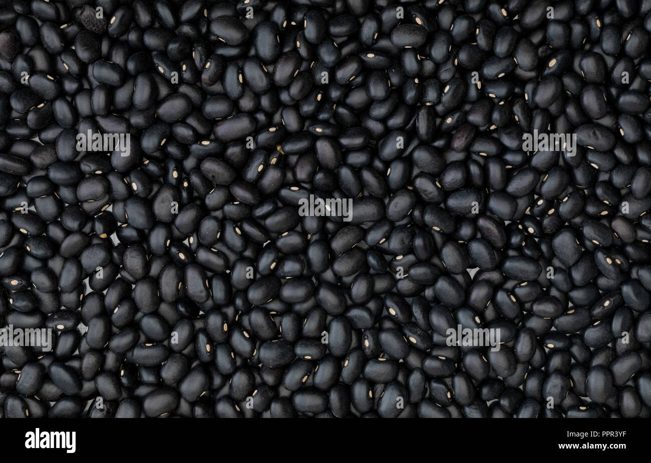 Bean texture - raw black beans (legume Stock Photo - Alamy
