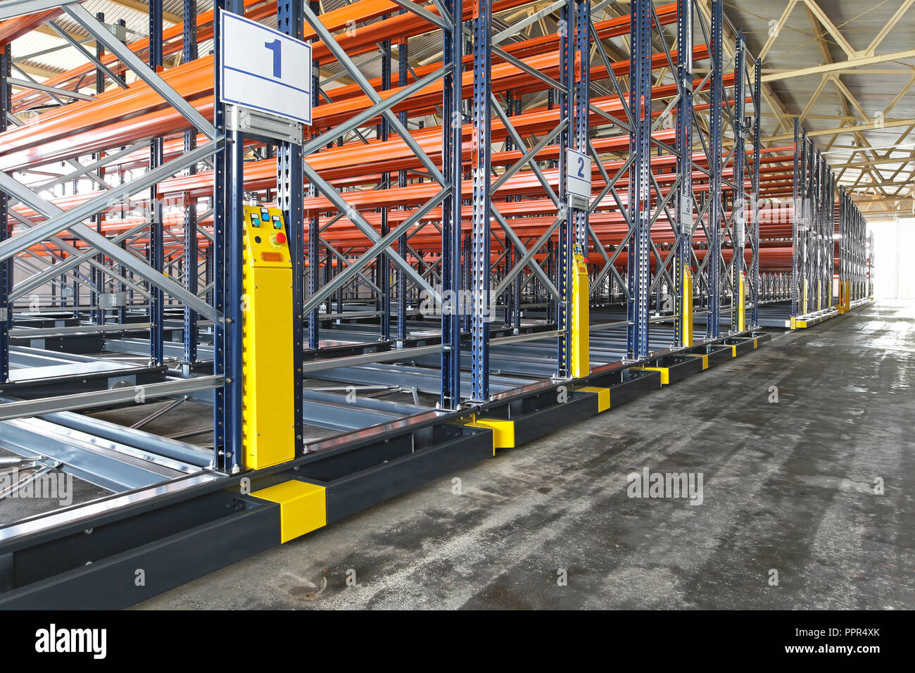 Powered mobile shelving system in distribution warehouse Stock Photo ...