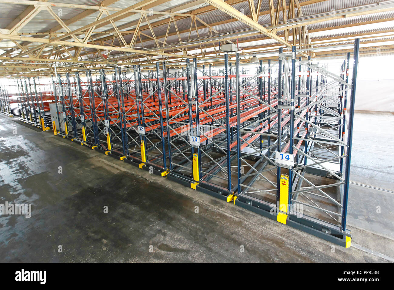 Empty shelves and racks in distribution warehouse Stock Photo - Alamy
