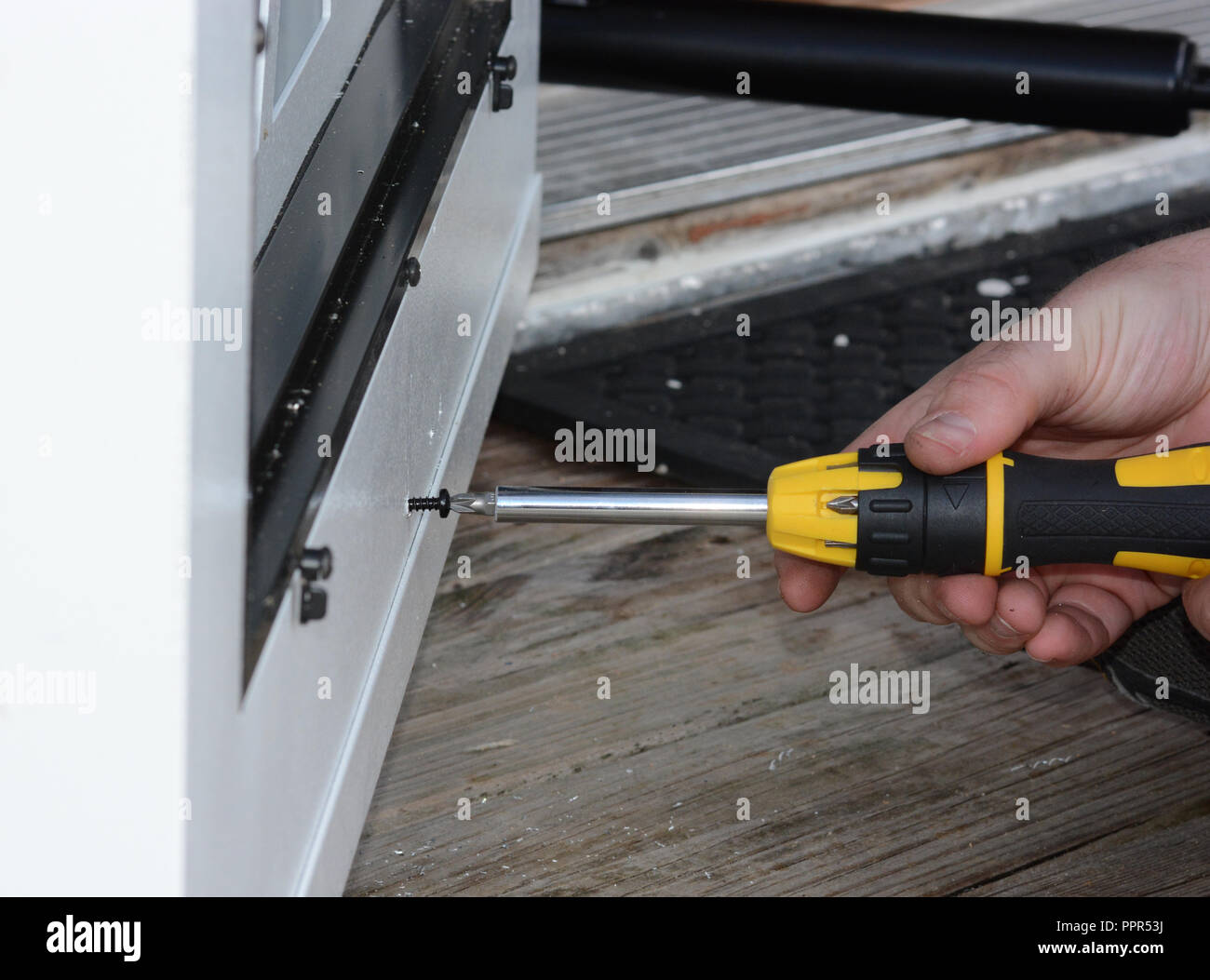 Man hands screwdriver repair hi-res stock photography and images - Alamy