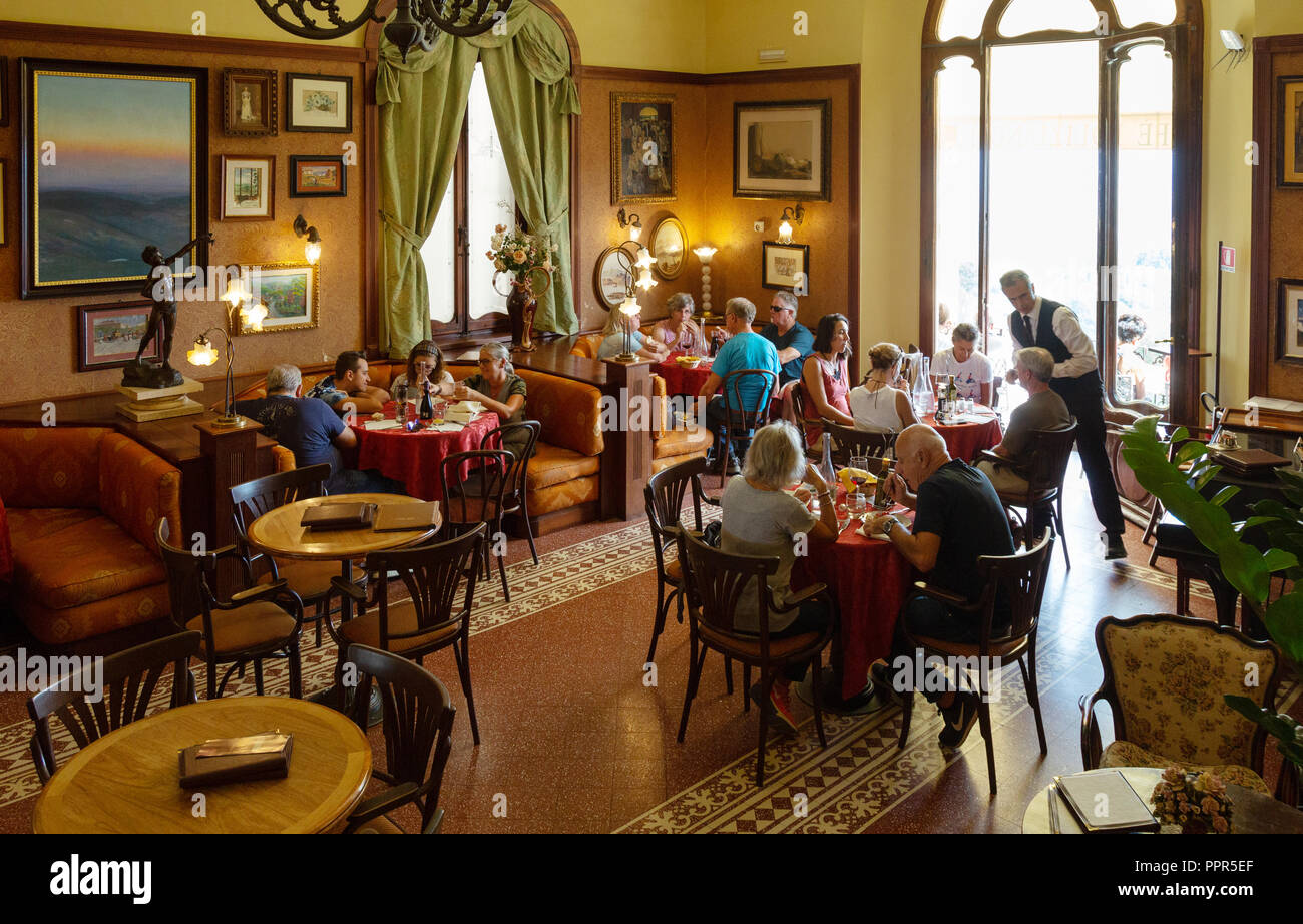 Italy cafe; people drinking and eating in the Interior of Caffe ...