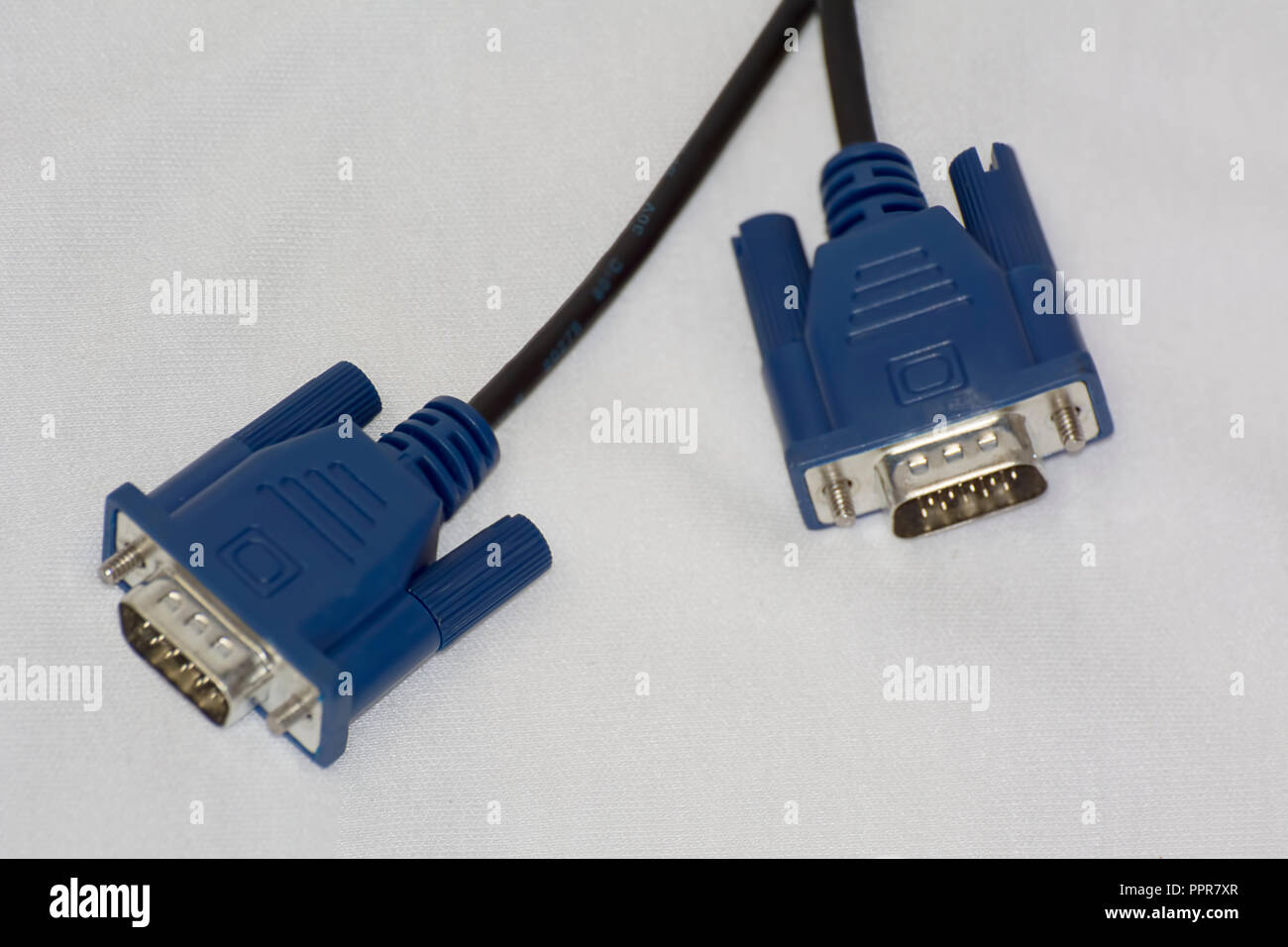 A couple blue male VGA cable connector wire isolated on white ...