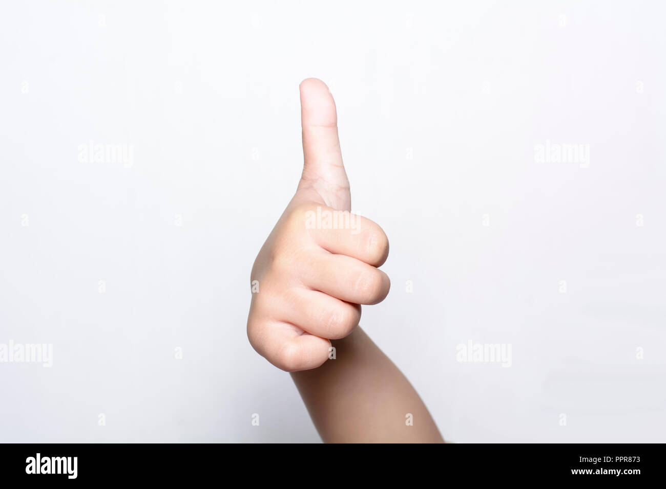 Girl raising one fingers up on hand that is thumb up its shows superb ...