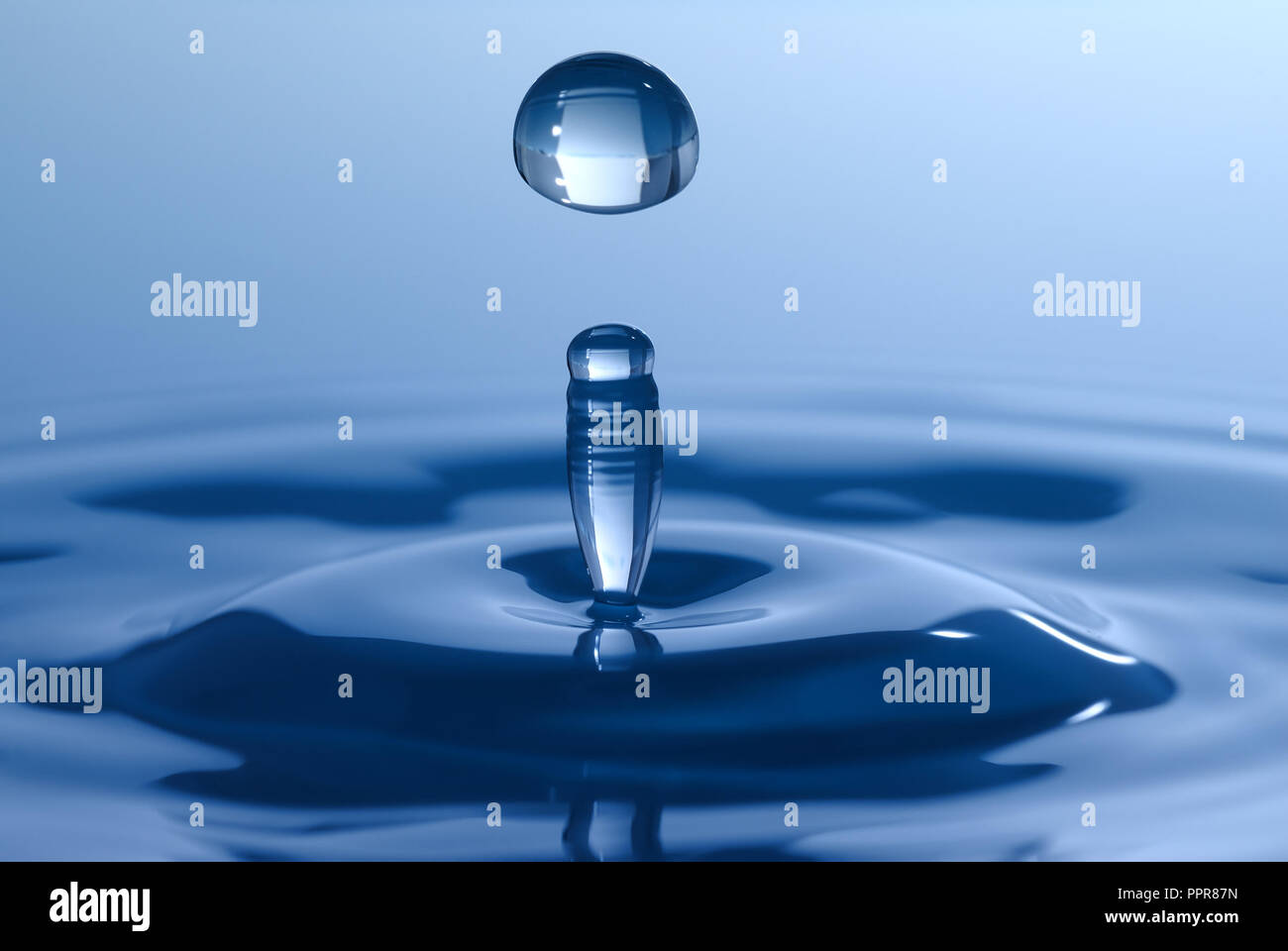 Water splash. Falling drop of rain Stock Photo - Alamy