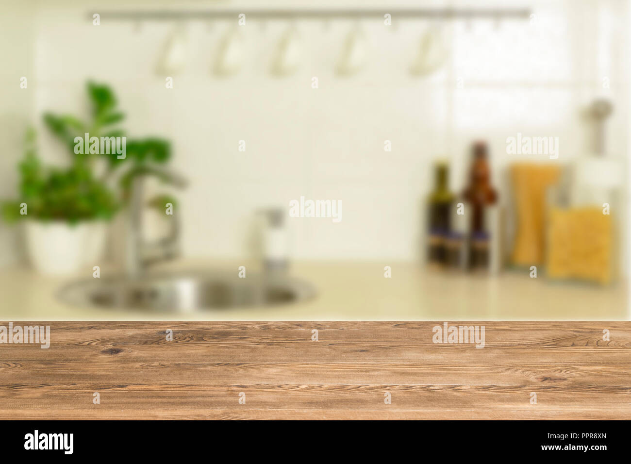 Wooden worktop on blur background Stock Photo - Alamy