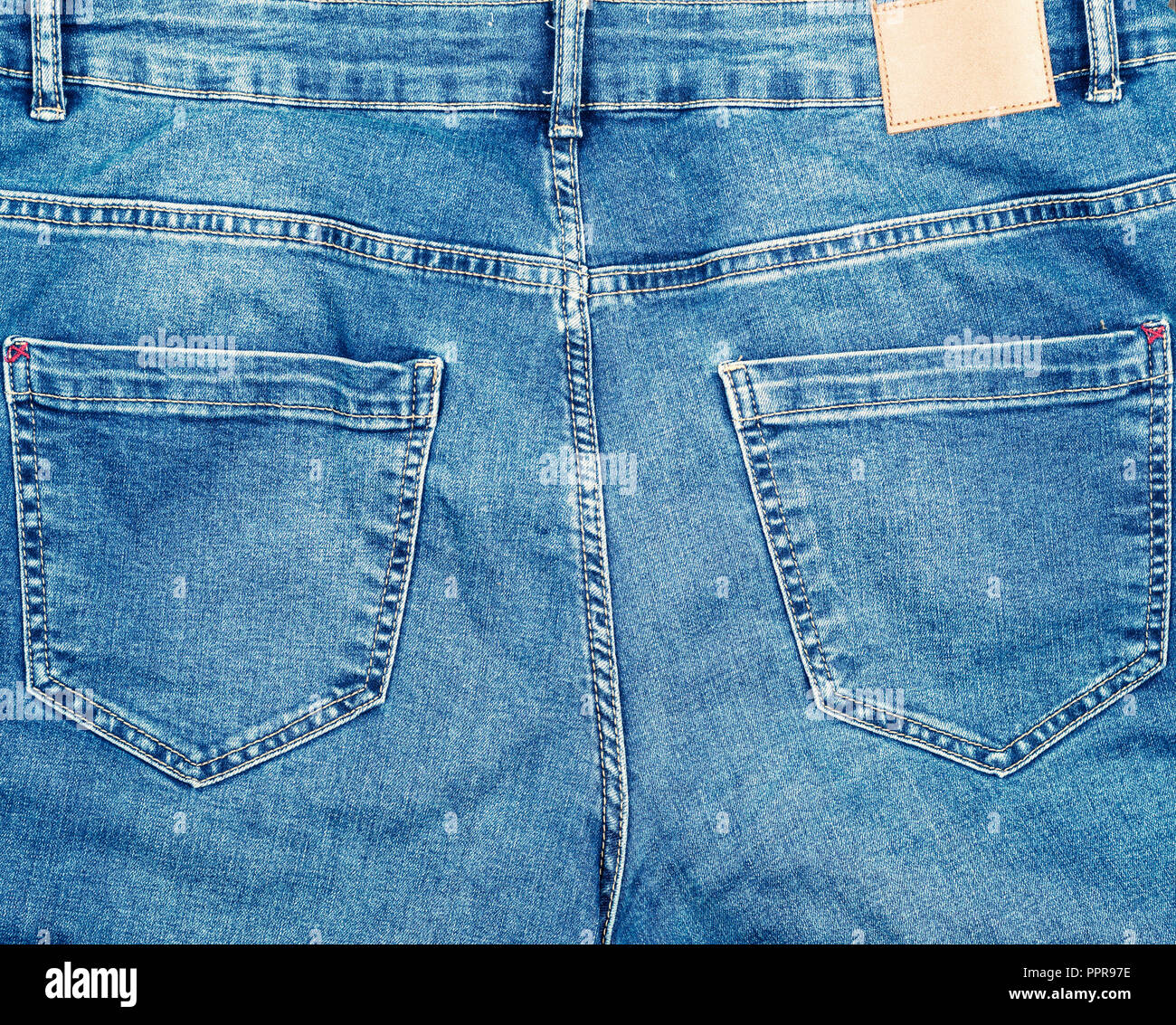 back of blue jeans with pockets and a leather tag, full frame Stock ...