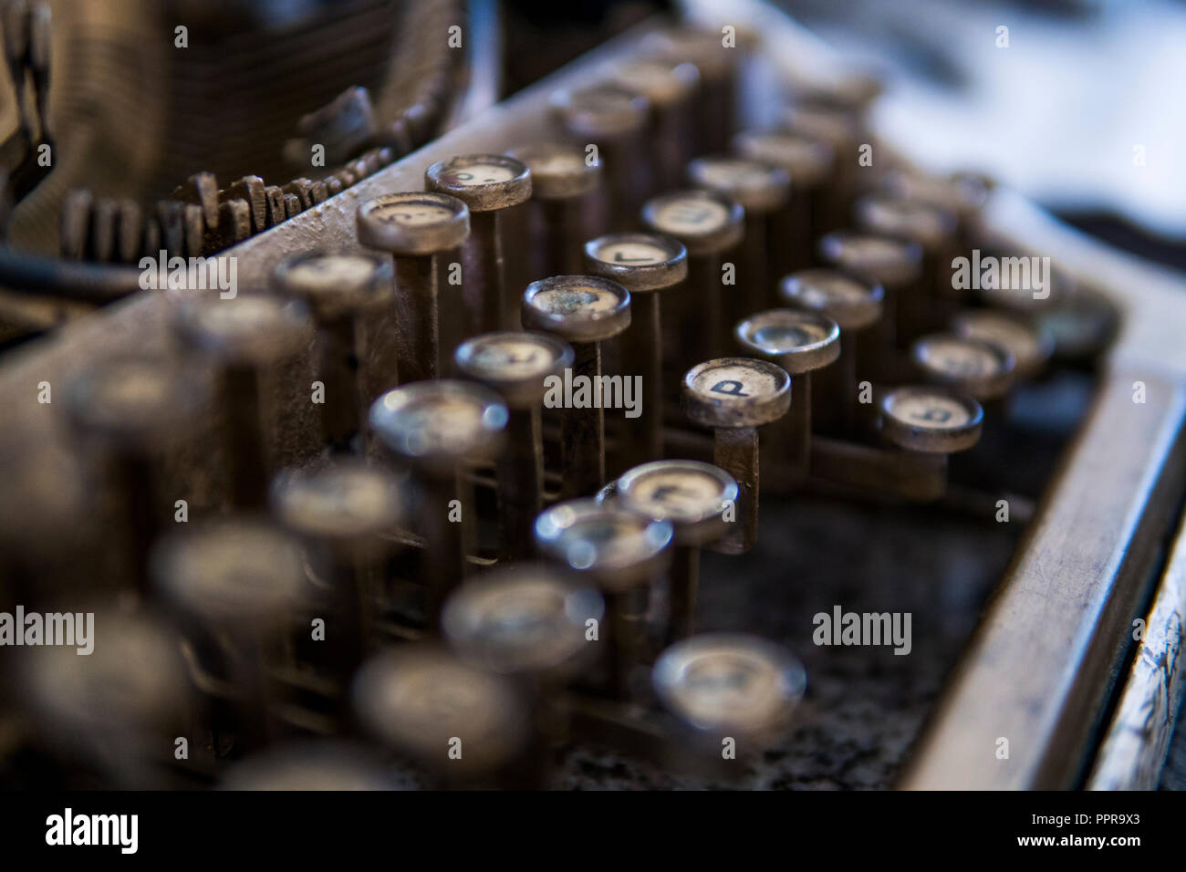 Close up view on an old dirty broken antique typewriter machine keys ...