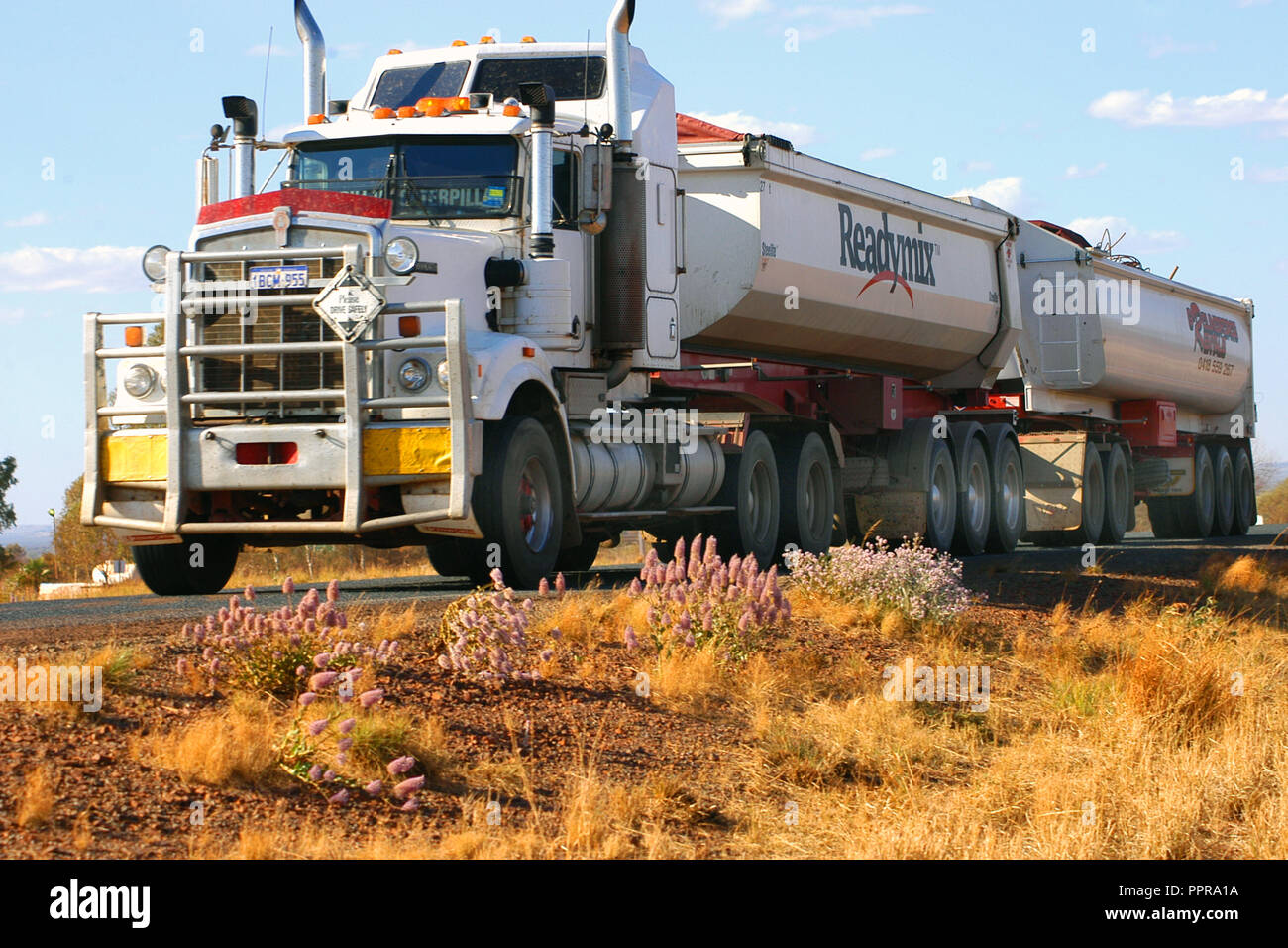 Road train travelling on an outback road in the Kimberleys, Western ...